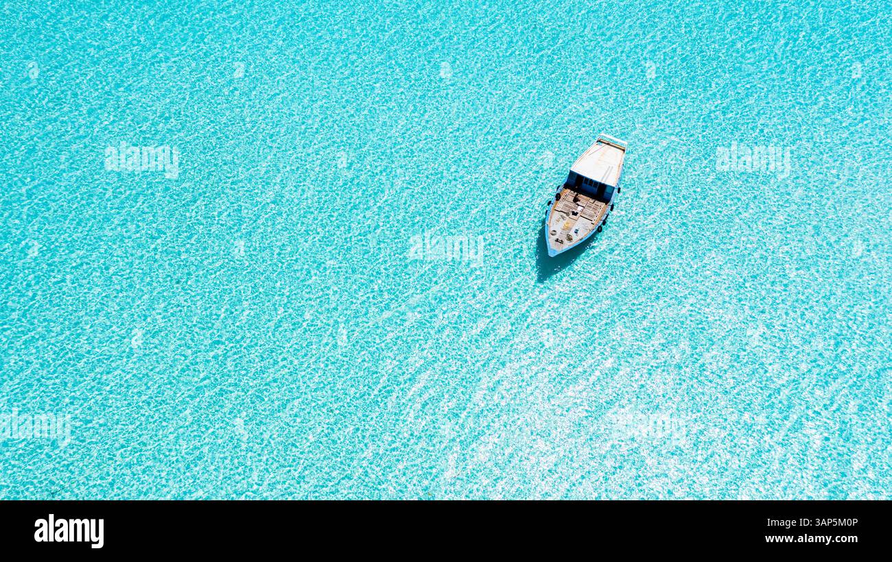 Aerial view of a fishing boat, dhoni, anchored at the coast of the ...