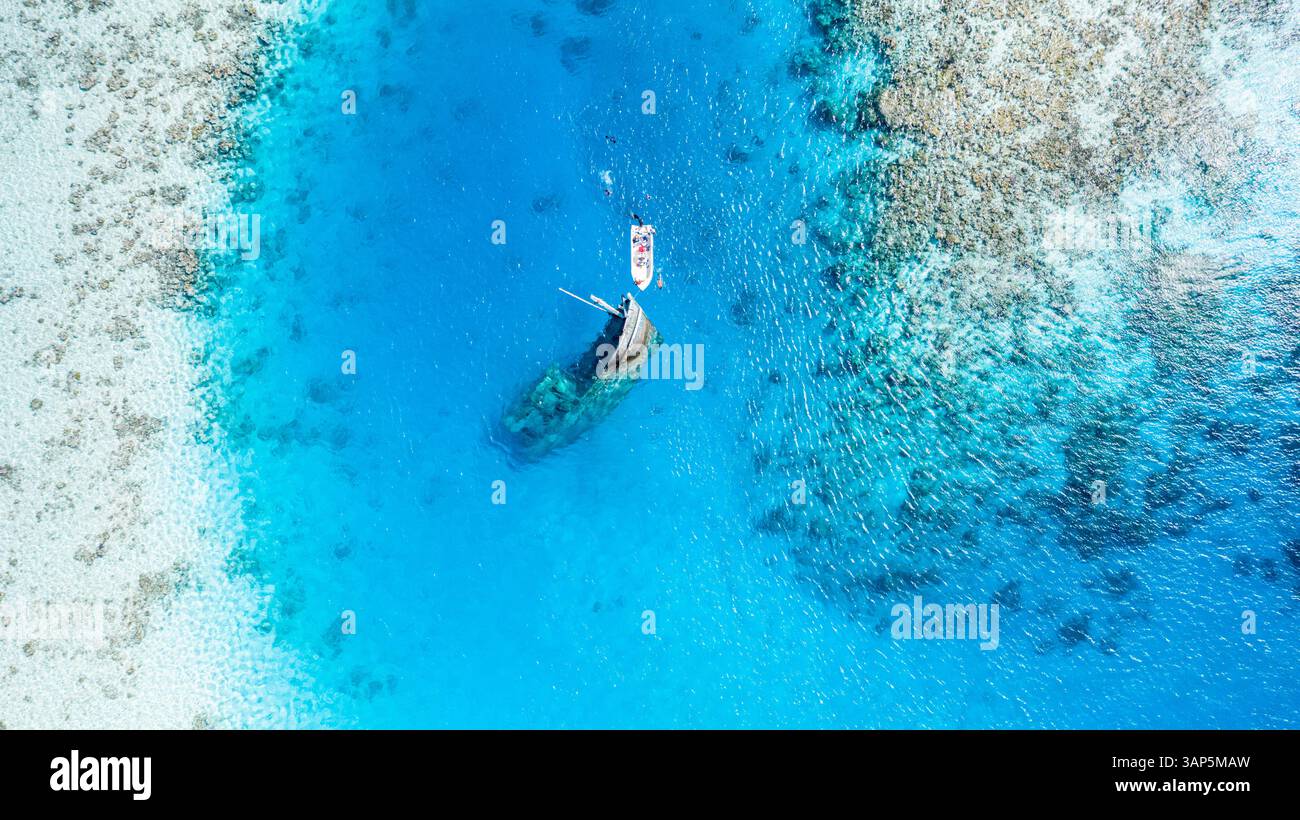 Aerial view of a ship wreck and a boat near Keyodhoo, Vaavu Atoll ...