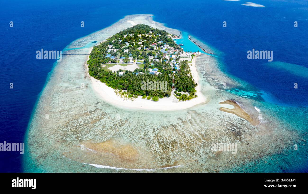 Aerial view of local island Omadhoo, located in Alif Dhaal Atoll ...