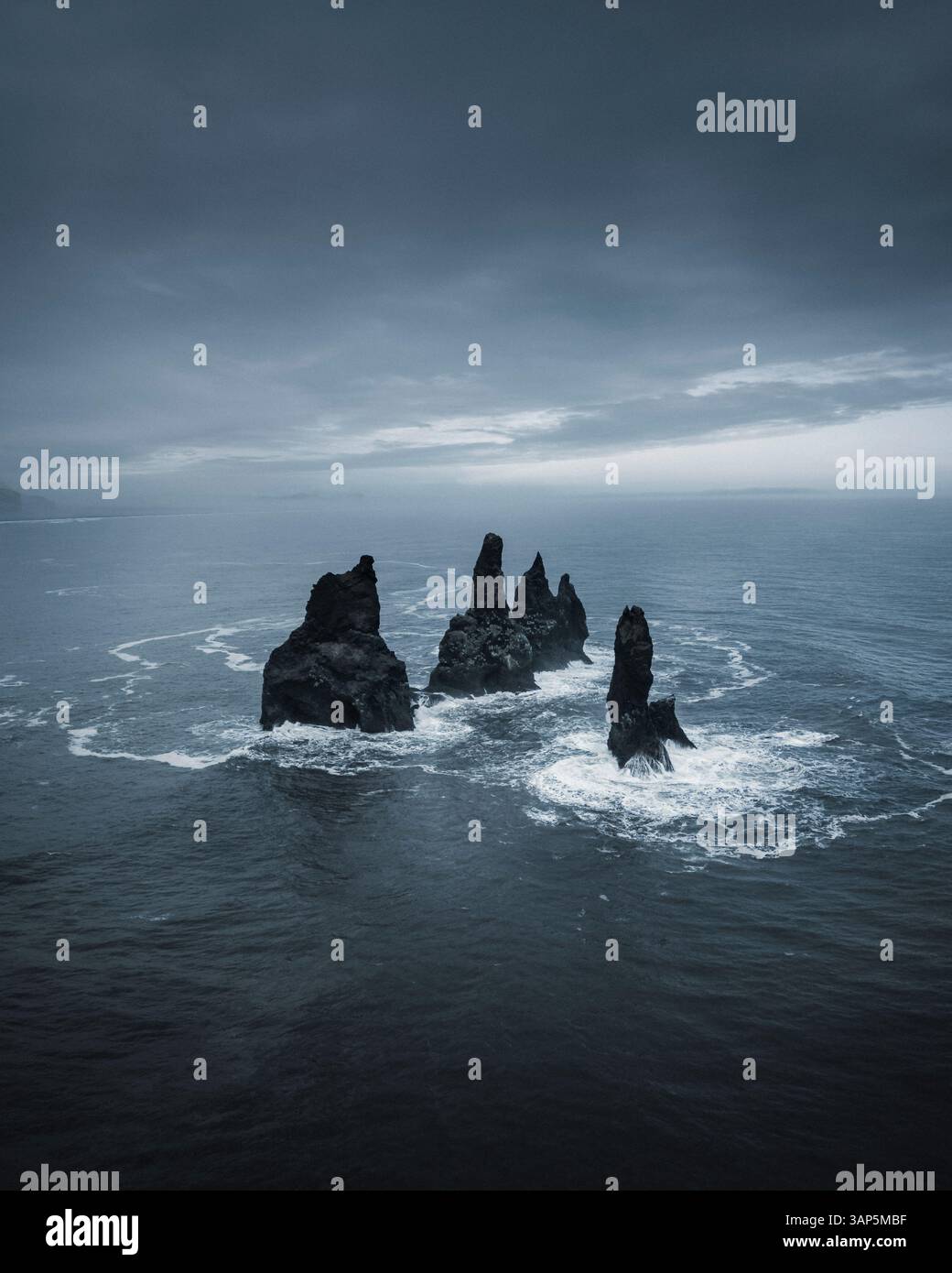 Aerial view of Reynisdrangar sea stacks near Vik, Iceland Stock Photo ...