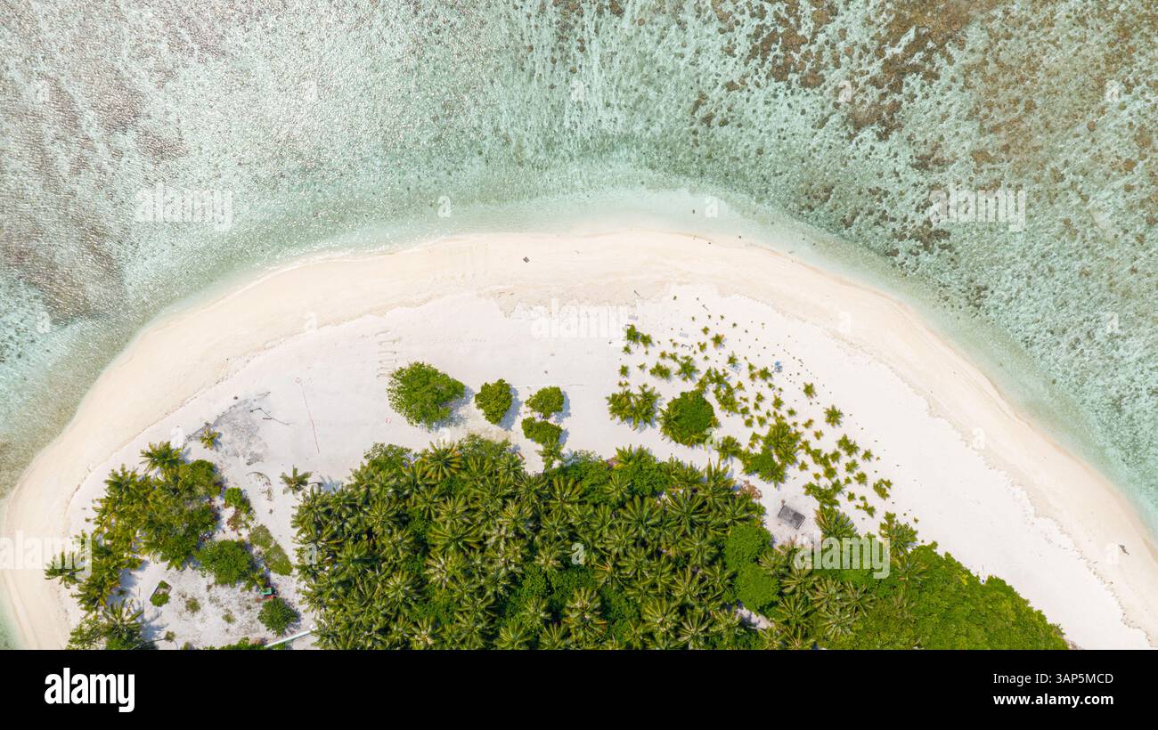 Aerial view of local island Omadhoo, located in Alif Dhaal Atoll ...