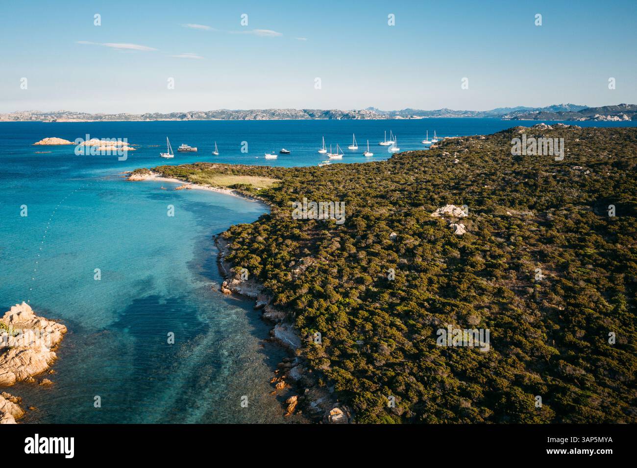 Aerial view of group of boats anchored in the bay of Cala Santa Maria ...
