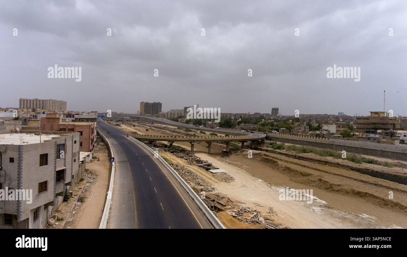 Aerial view of lyari expressway with urban skyline and busy traffic ...