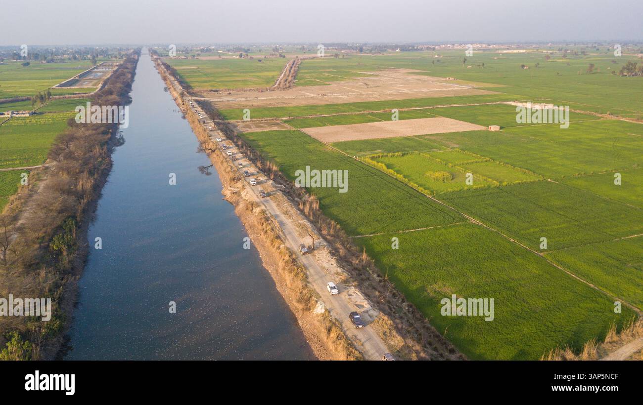 Aerial view of brb canal surrounded by lush fields and a tranquil road ...