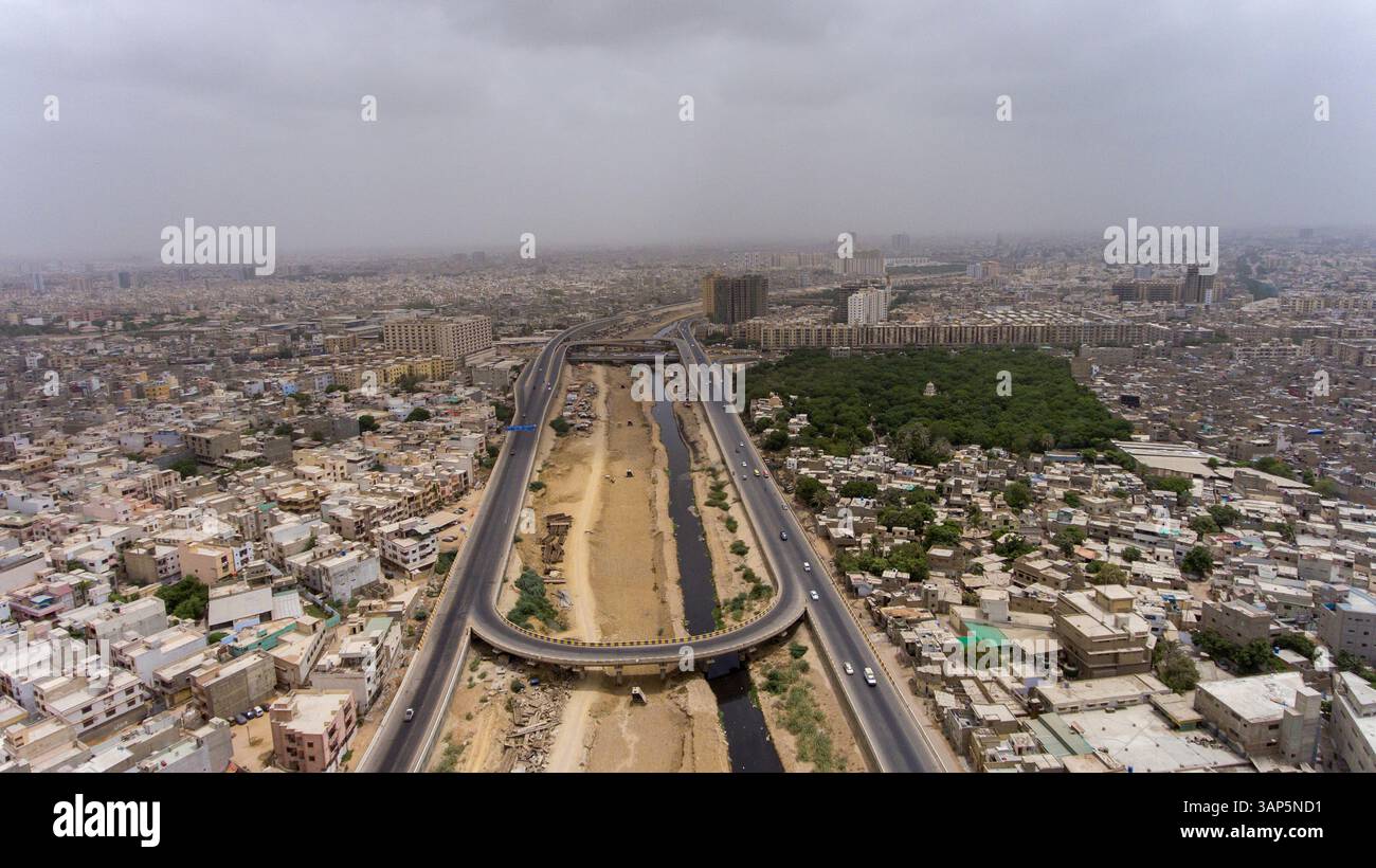 Aerial view of lyari expressway with busy traffic and modern buildings ...