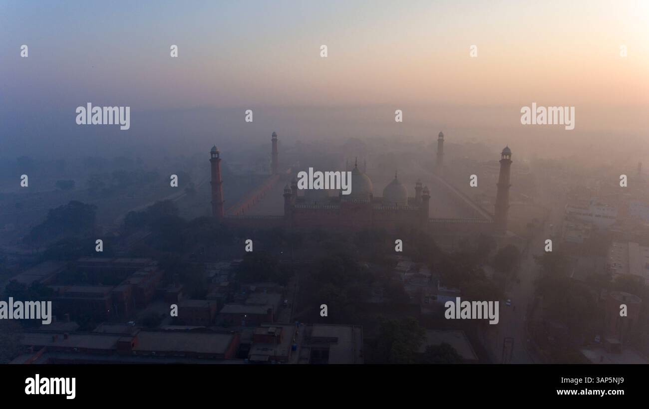 Aerial view of Minar-e-Pakistan amidst a beautiful cityscape at sunset, Lahore, Punjab, Pakistan ...