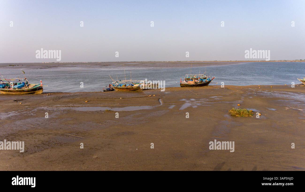 Aerial view of beautiful mangroves with traditional wooden boats along ...