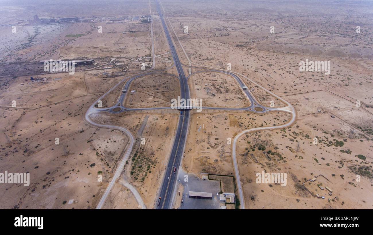 Aerial view of hyderabad motorway intersecting arid desert landscape ...