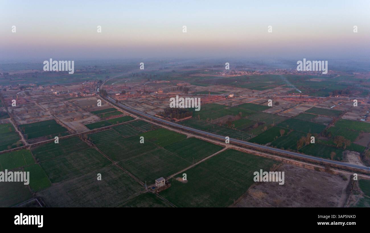 Aerial view of hiran minar surrounded by beautiful fields and rural ...