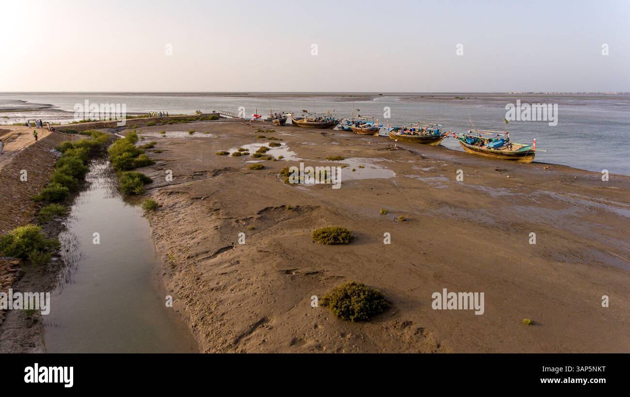 Aerial view of beautiful mangroves and boats along the coast and marsh ...