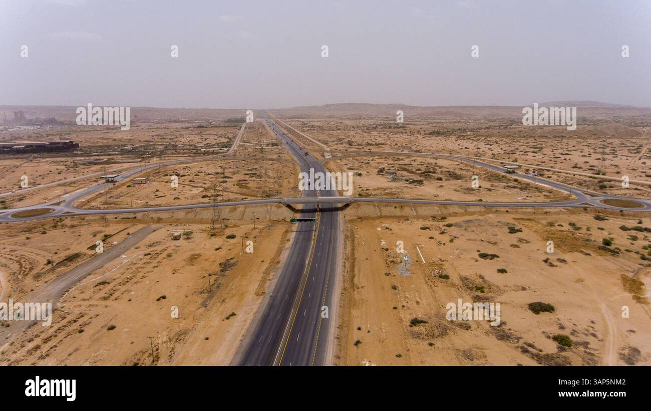 Aerial view of the scenic Hyderabad Motorway surrounded by arid desert ...