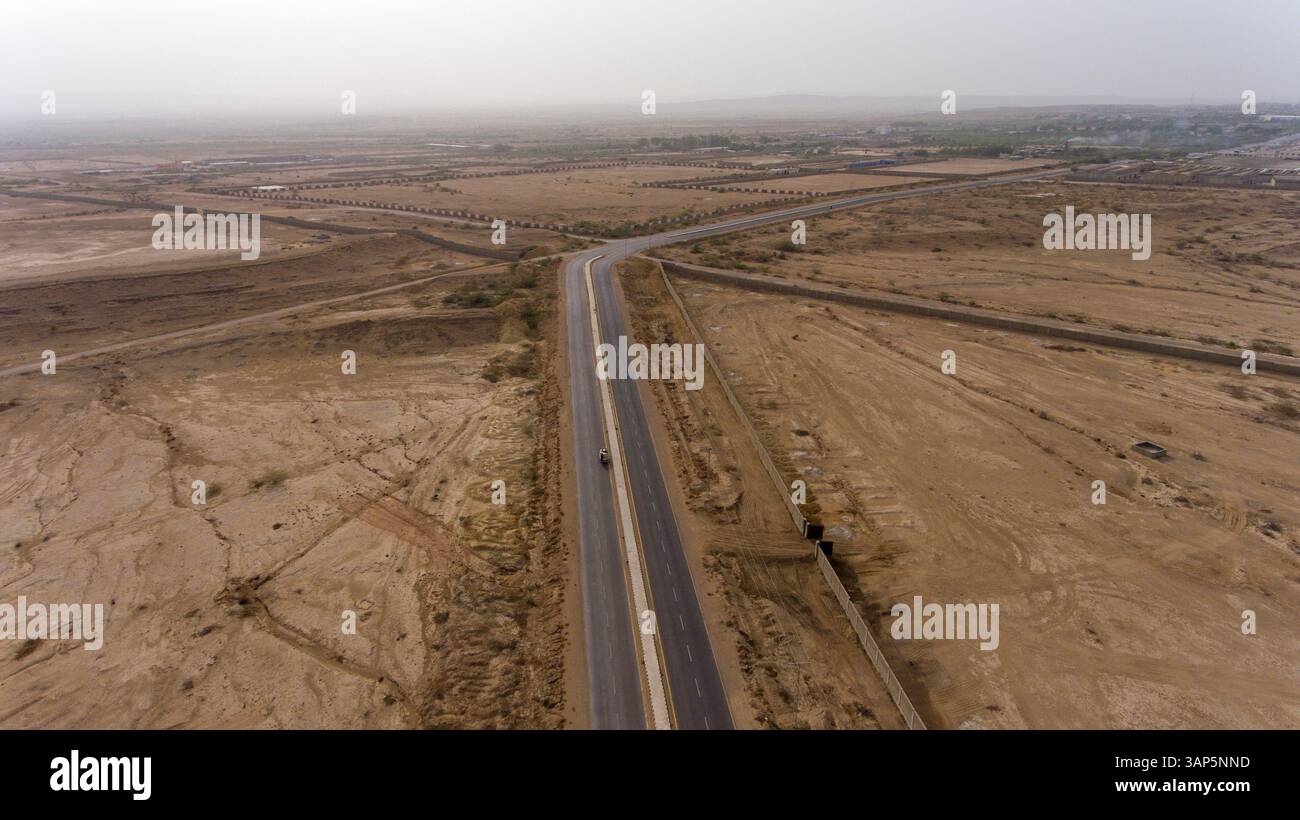 Aerial view of Jhimpir Wind Power Plant surrounded by arid desert ...