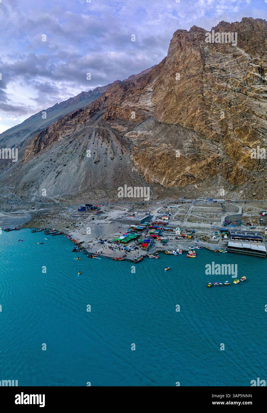 Aerial view of Atabad Lake surrounded by majestic mountains and serene ...
