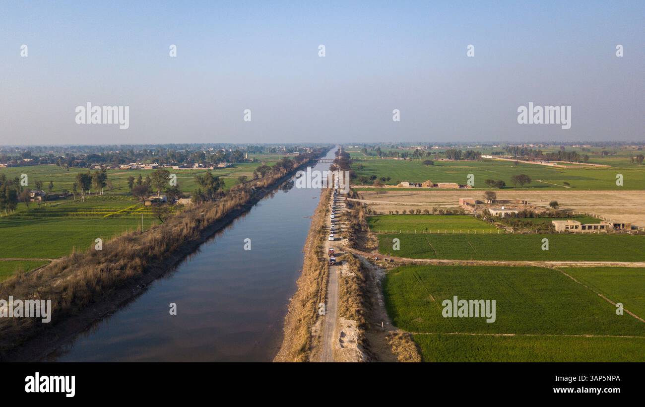 Aerial view of BRB Canal surrounded by lush fields and rural homes ...