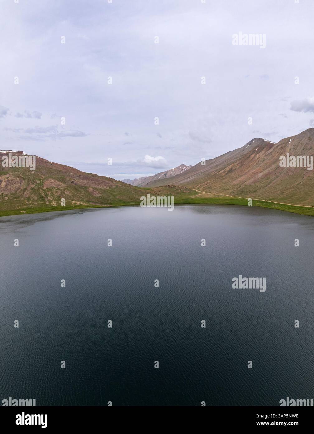 Aerial view of serene Deosai Plains with tranquil lake and majestic ...