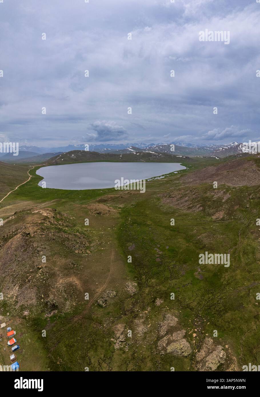 Aerial view of deosai plains with majestic mountains, serene lake, and ...