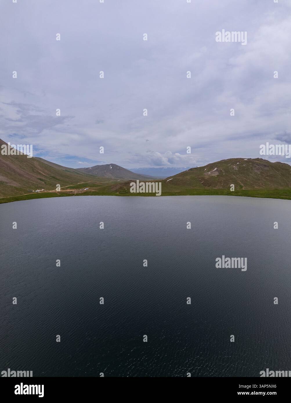Aerial view of serene Deosai Plains with tranquil lake and majestic ...