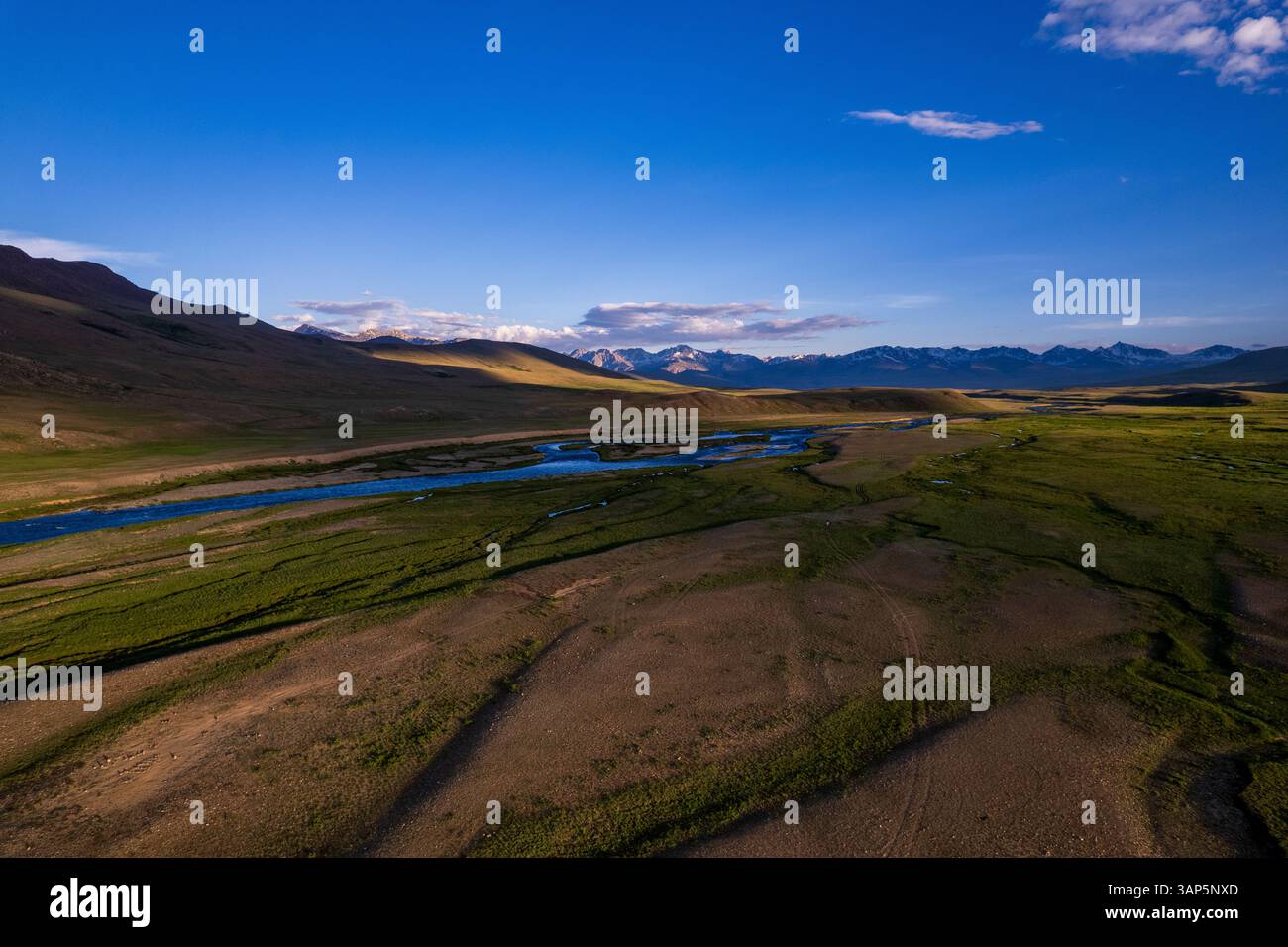 Aerial view of deosai plains with majestic mountains and a serene river ...