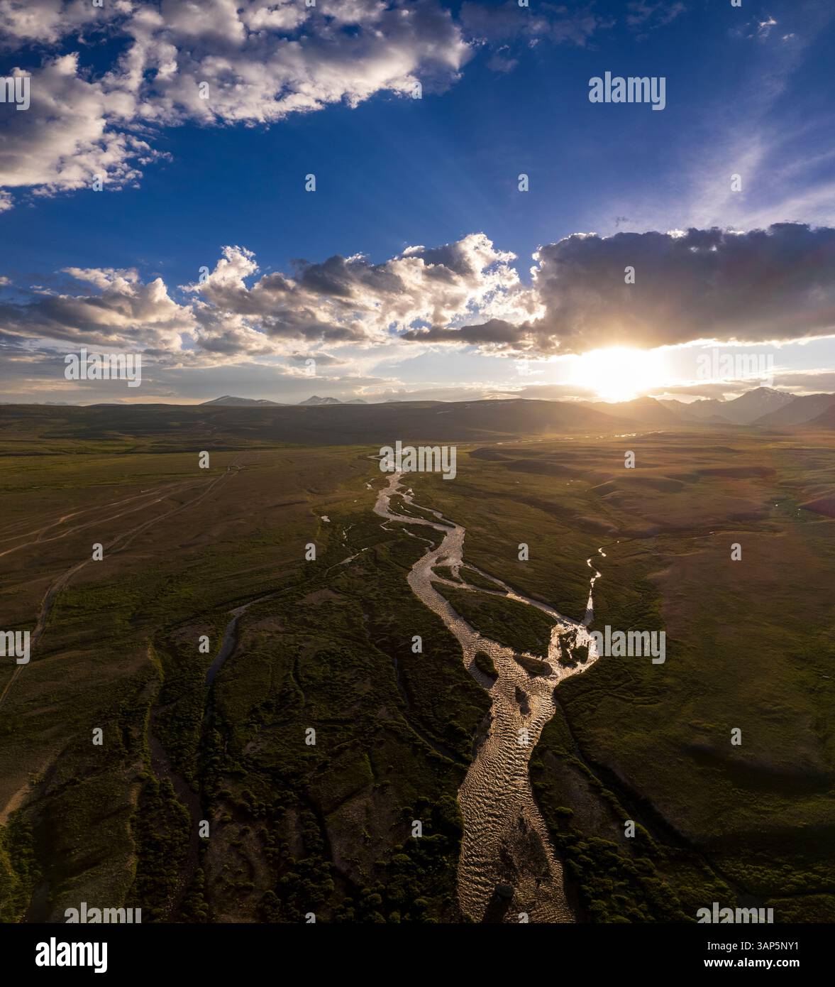 Aerial view of deosai plains at sunset with winding river and majestic ...