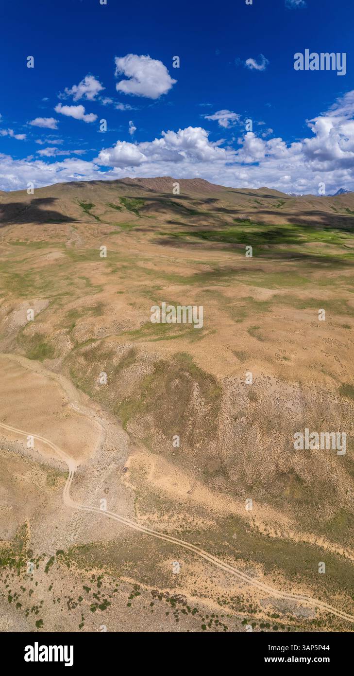 Aerial view of breathtaking Deosai Plains with majestic mountains and ...