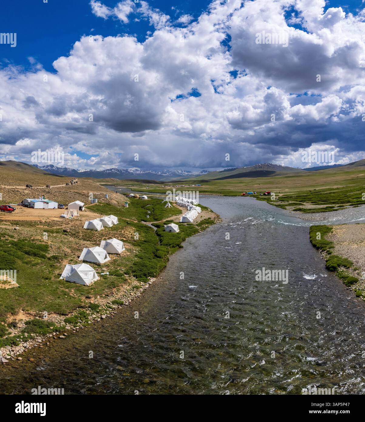 Aerial view of serene Deosai Plains with majestic mountains, clear sky ...