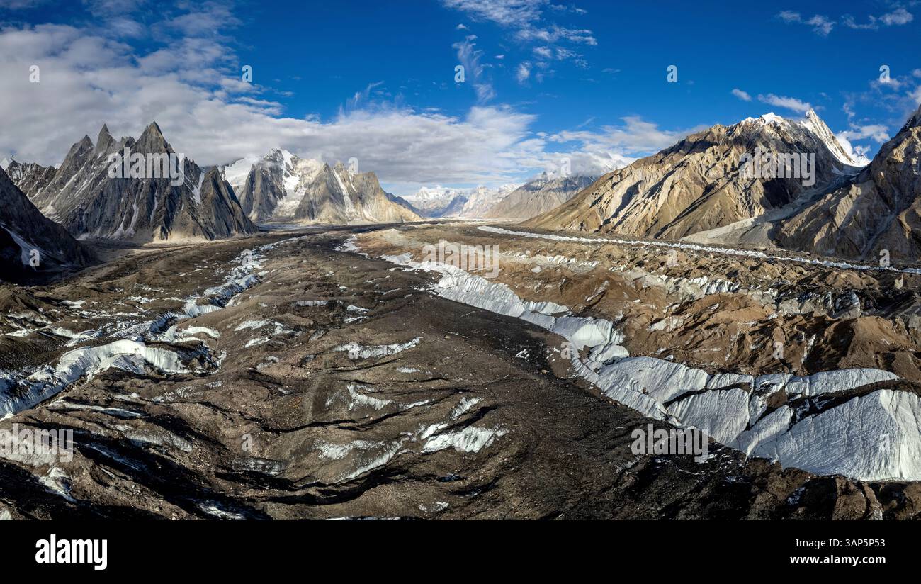 Aerial view of majestic snow-covered mountains and a vast glacier ...