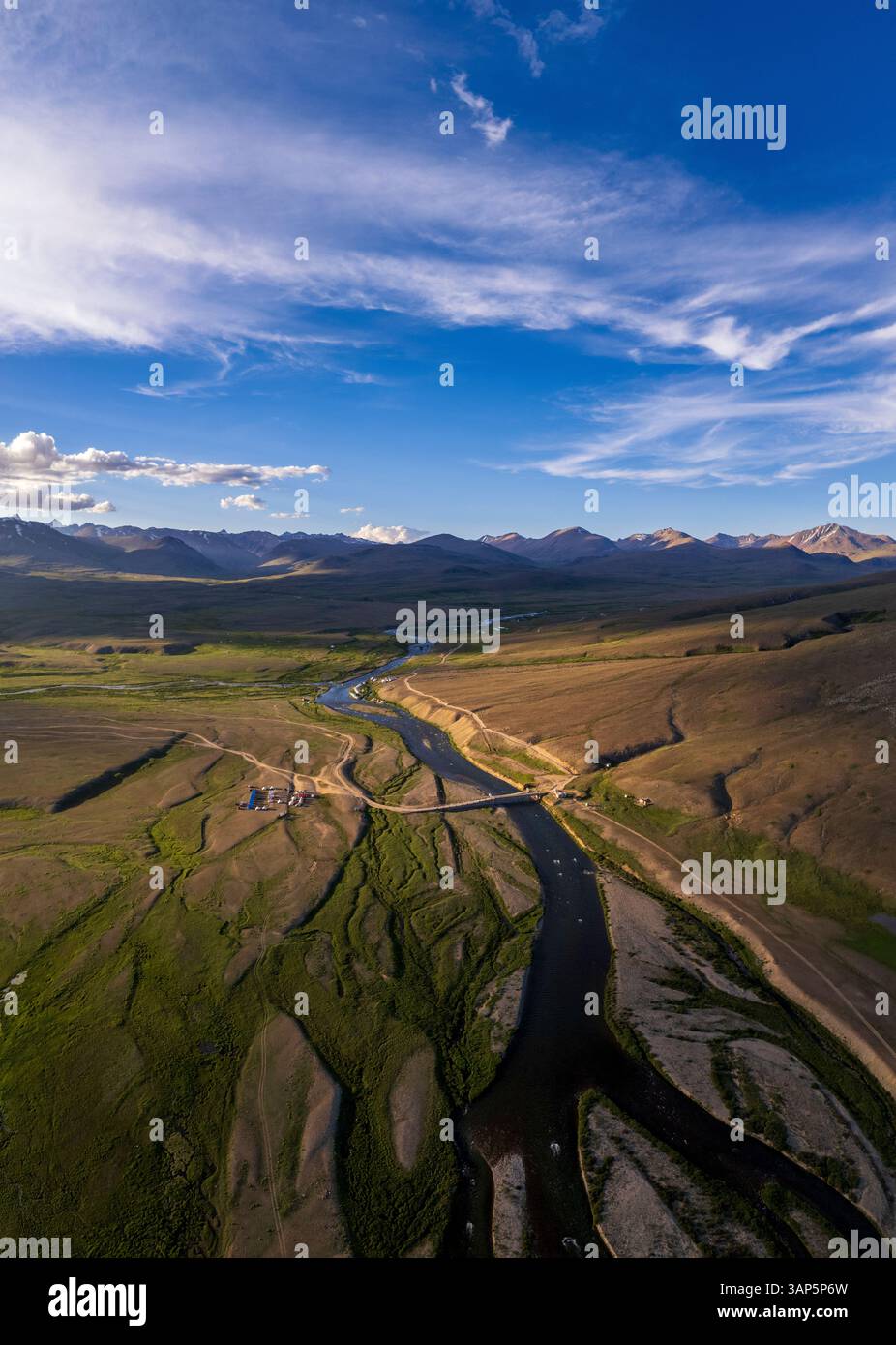 Aerial view of breathtaking Deosai Plains with majestic mountains and a ...
