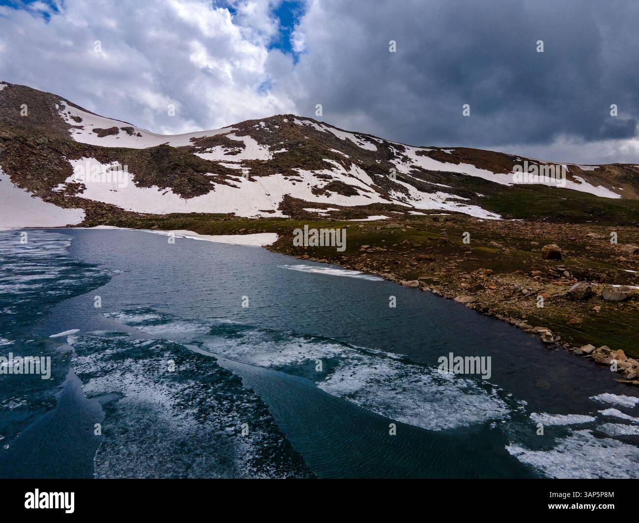 Aerial view of serene sambaksar pass with snowcapped mountains and a ...