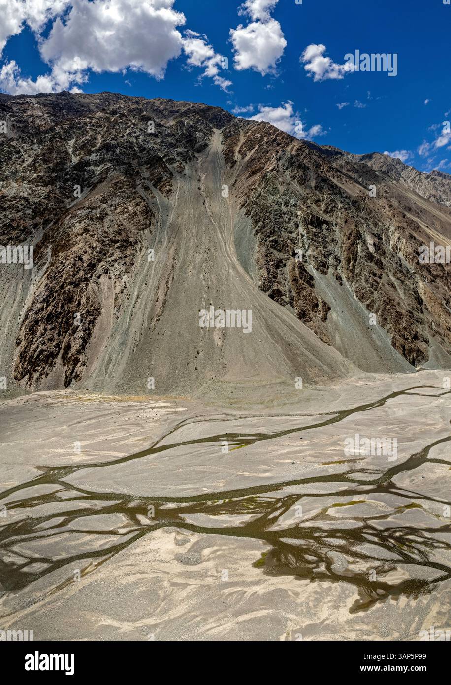 Aerial view of serene Sadpara Lake surrounded by majestic mountains and ...