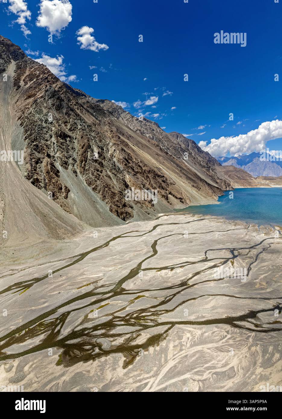 Aerial view of serene Sadpara Lake surrounded by majestic mountains and ...