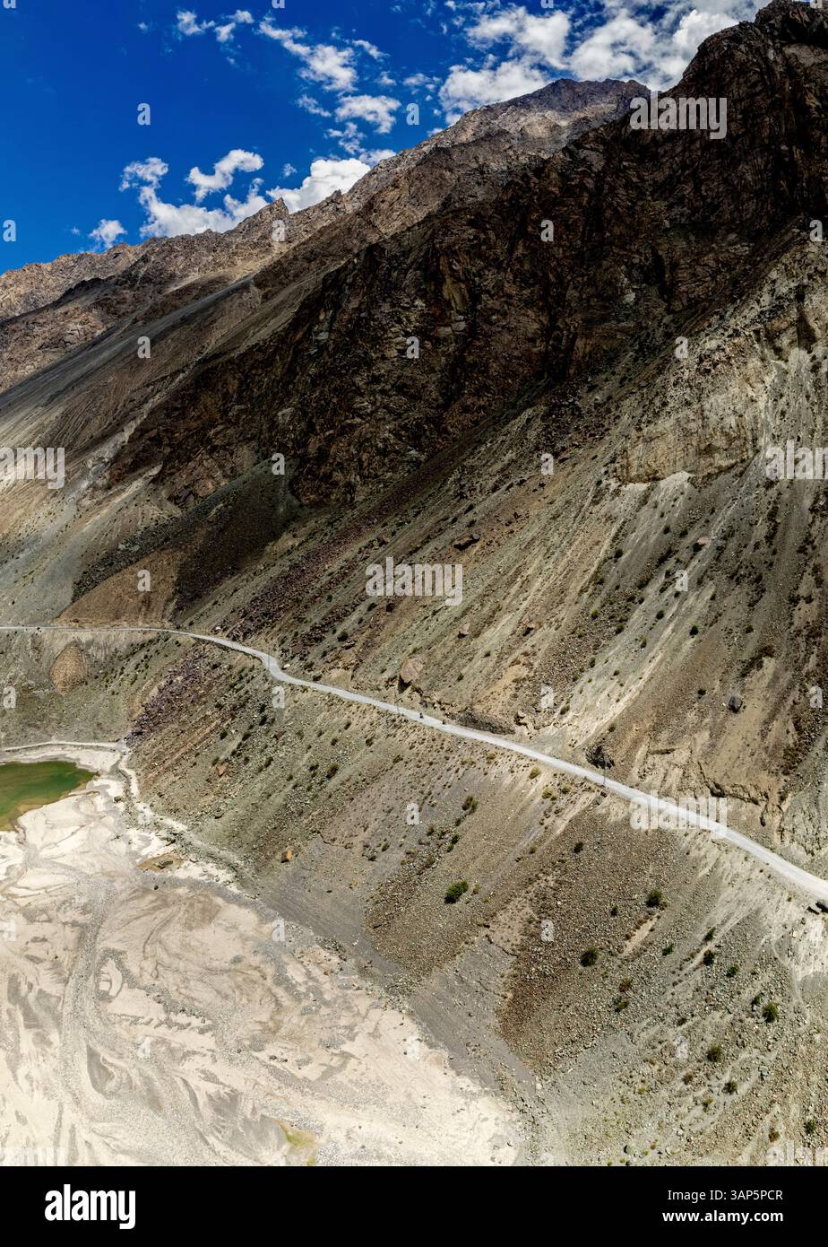 Aerial view of Sadpara Lake surrounded by majestic mountains and a ...