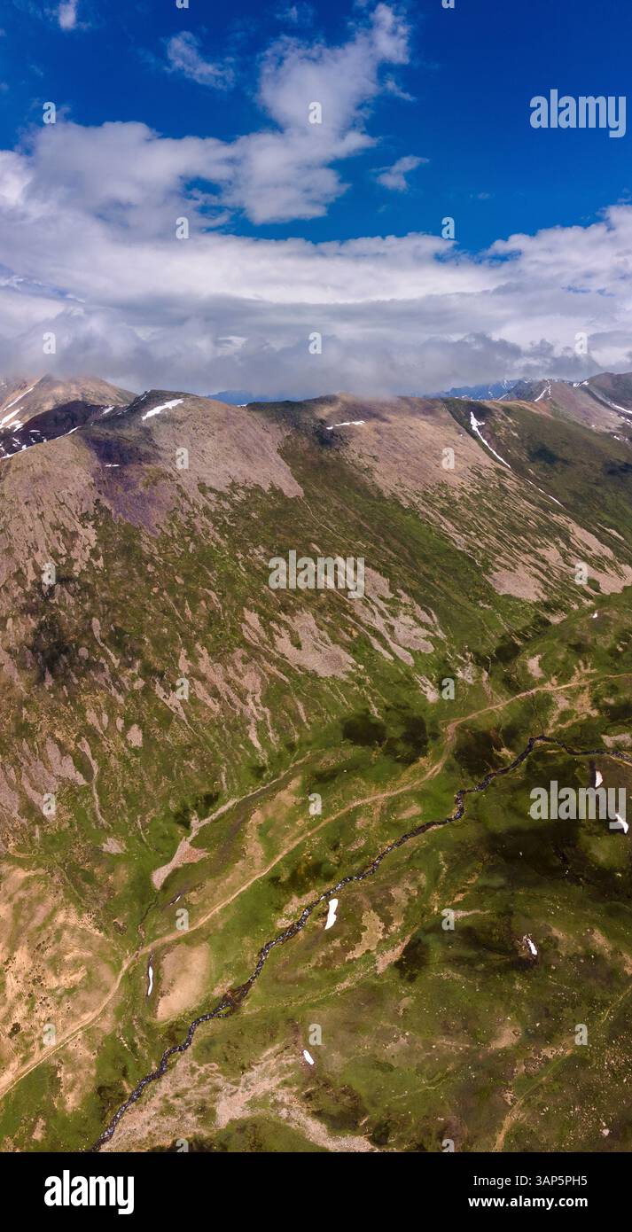 Aerial view of majestic mountain landscape under a serene sky with ...