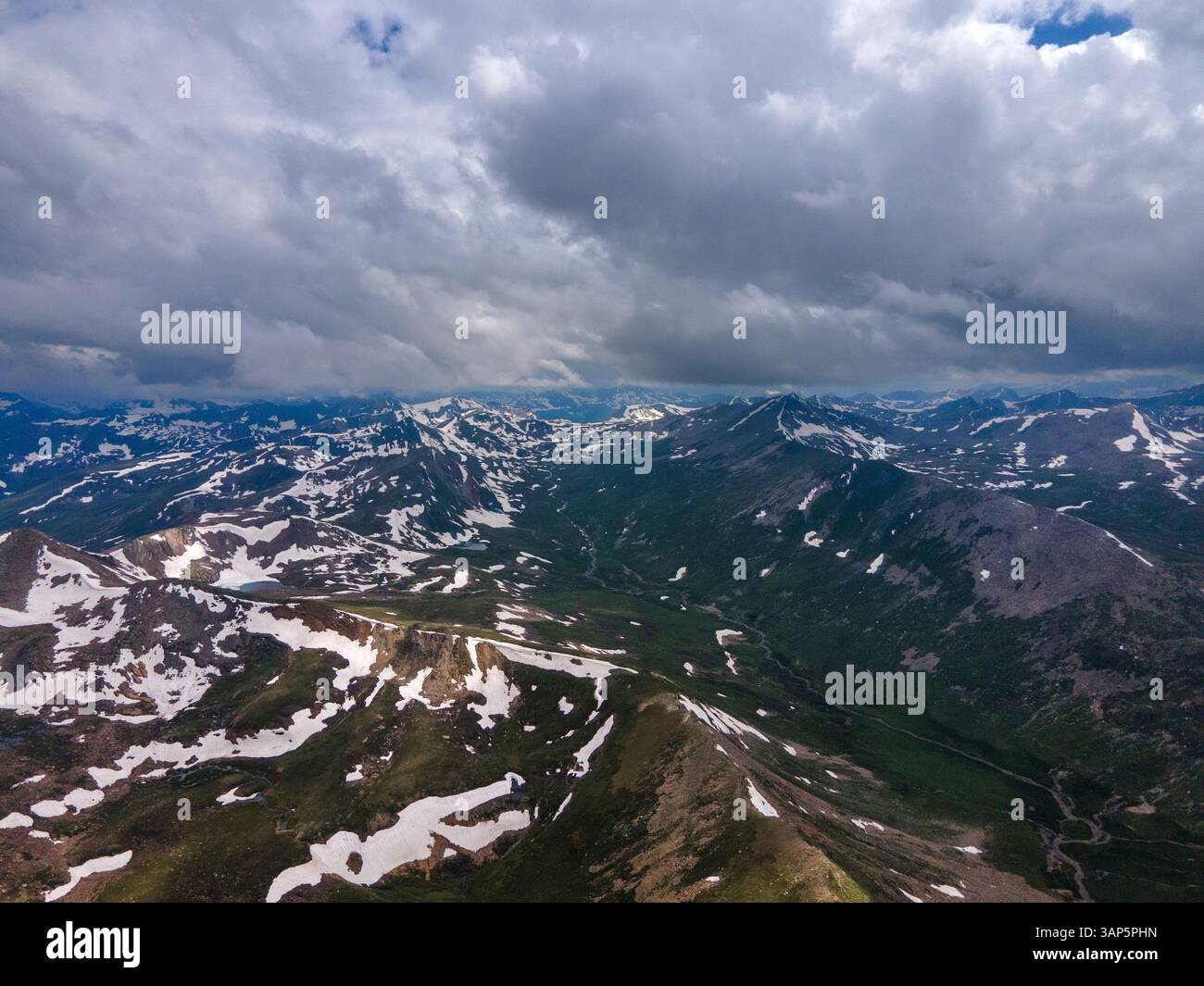 Aerial view of majestic snowy mountains under cloudy skies at Sambaksar ...