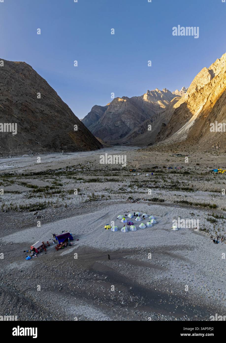 Aerial view of beautiful tents in a serene campsite surrounded by ...