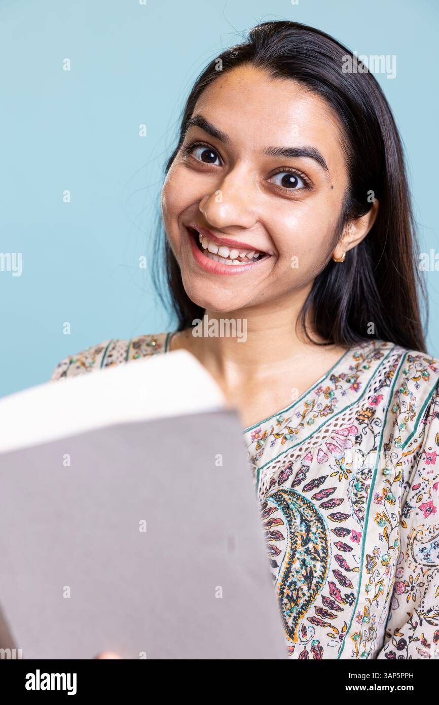 Happy joyful person reading captivating book and enjoying lecture hobby ...