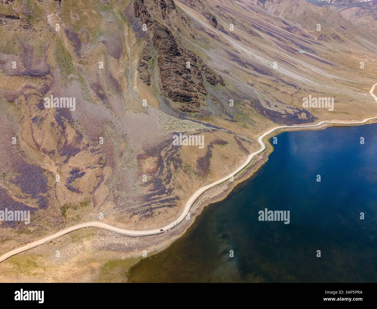 Aerial view of scenic Shandur Lake surrounded by beautiful mountains ...