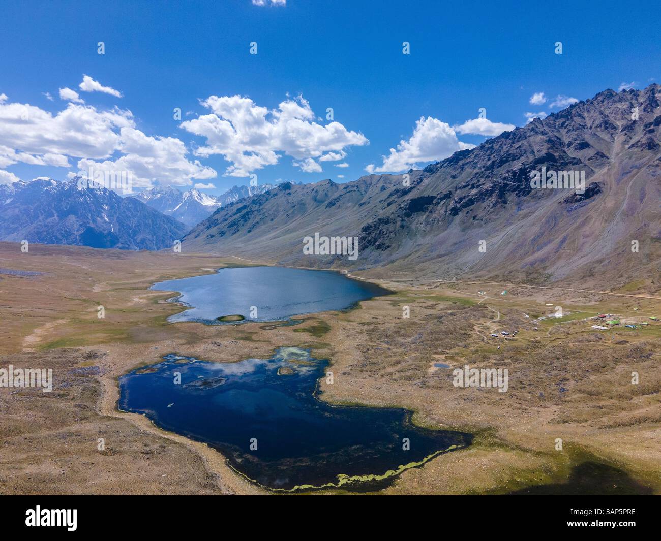 Aerial view of serene and majestic mountain lake surrounded by rugged ...