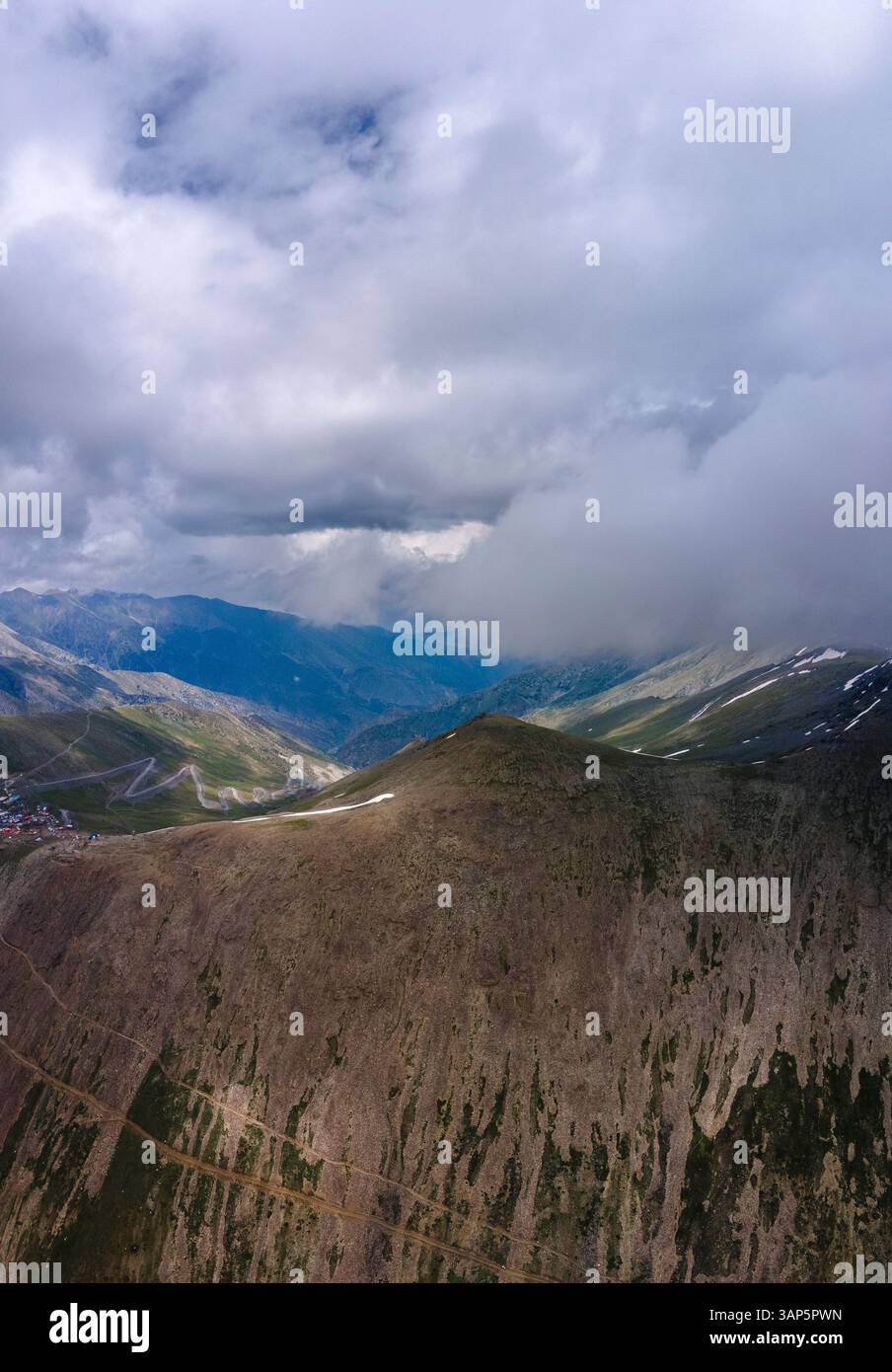 Aerial view of majestic Babusar Pass with clouds and rugged mountains ...