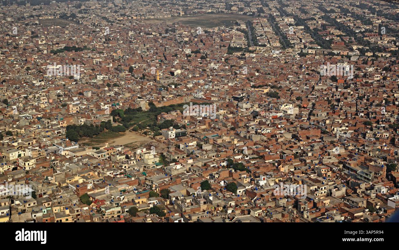 Aerial view of sprawling urban landscape with dense rooftops and ...