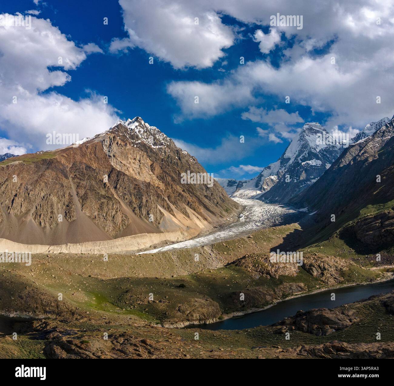Aerial view of breathtaking snow-capped mountains and a pristine valley ...