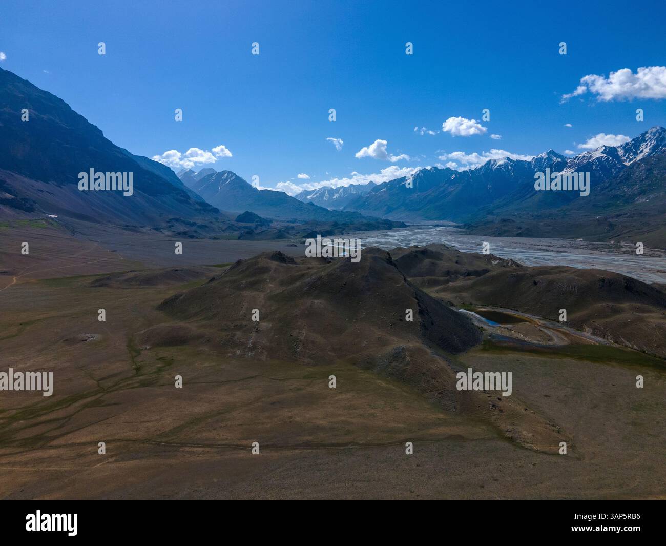 Aerial view of breathtaking rugged landscape and majestic mountains in ...
