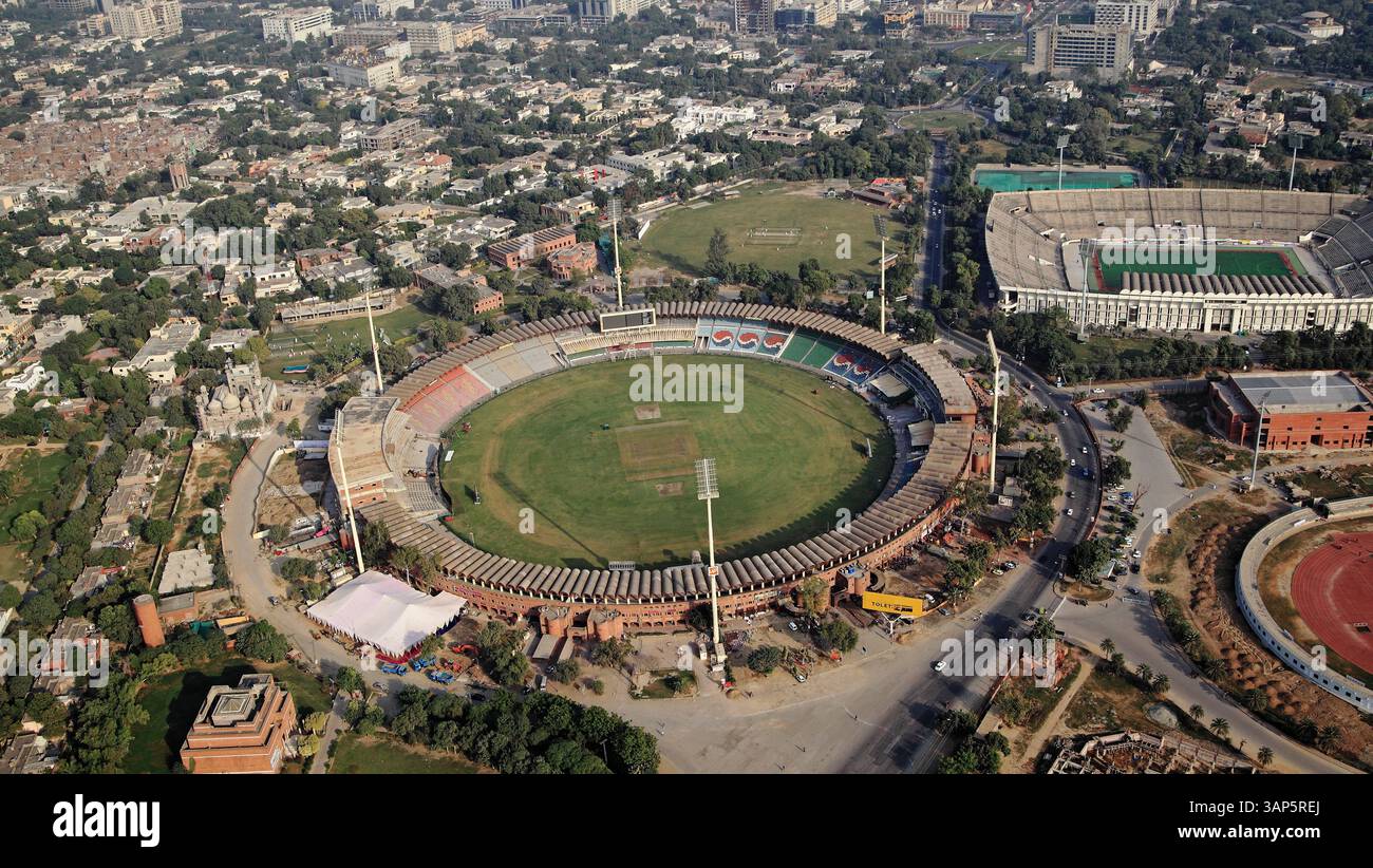 Aerial view of vibrant stadium surrounded by urban landscape and ...