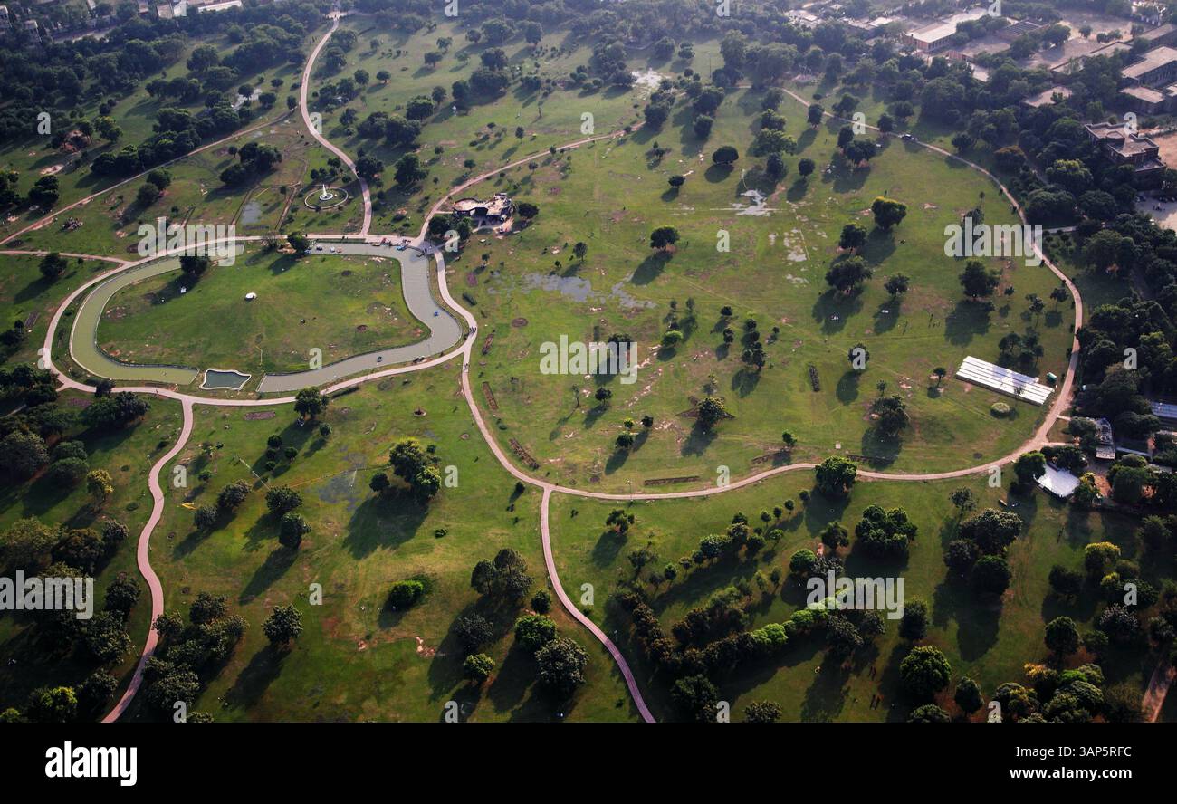 Aerial view of lush urban park with trees and pathways, Lahore ...