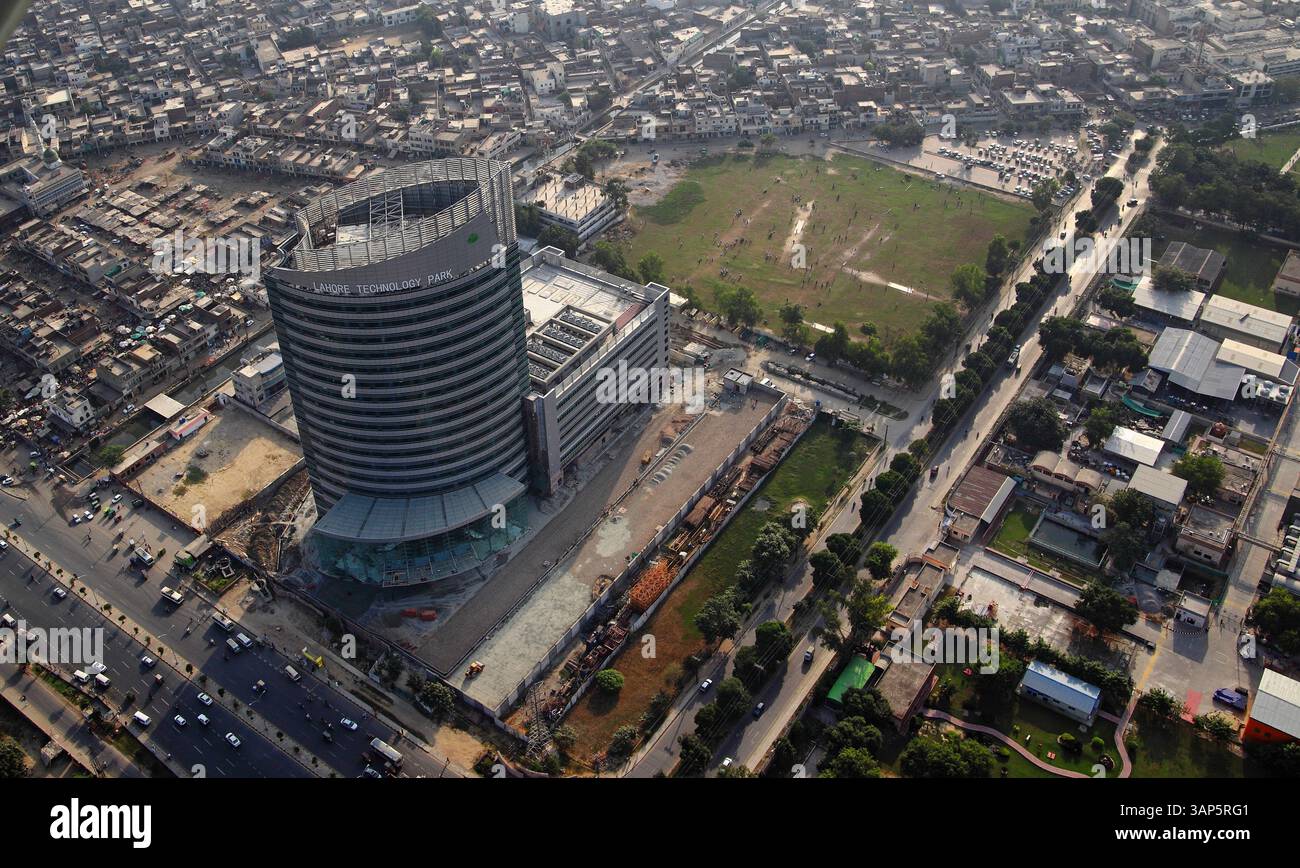 Aerial view of modern urban landscape with busy roads and skyscrapers ...
