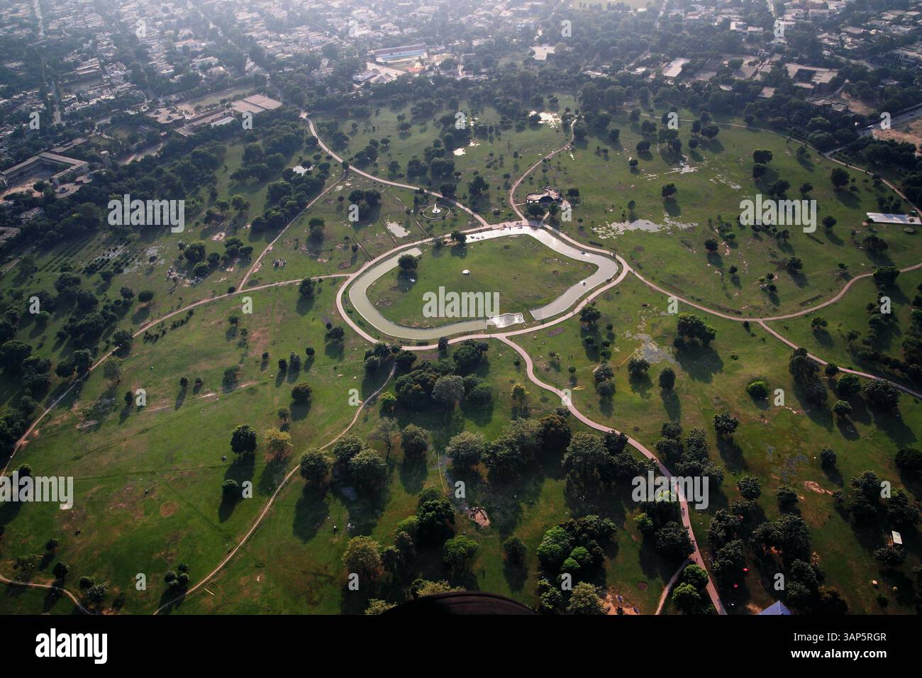 Aerial view of beautiful urban park with greenery, trees, and pathways ...