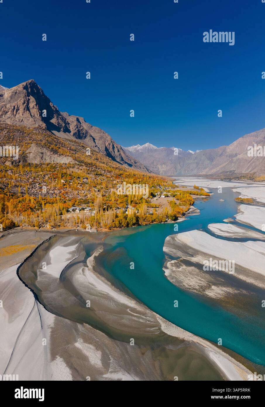 Aerial view of Barah Valley with a winding river, majestic mountains ...