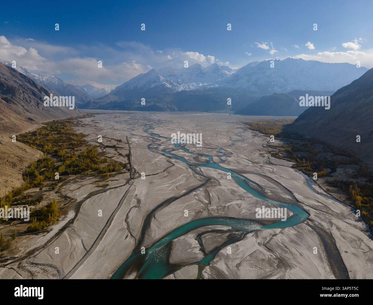 Aerial view of majestic mountains, tranquil valley, and glacier at ...