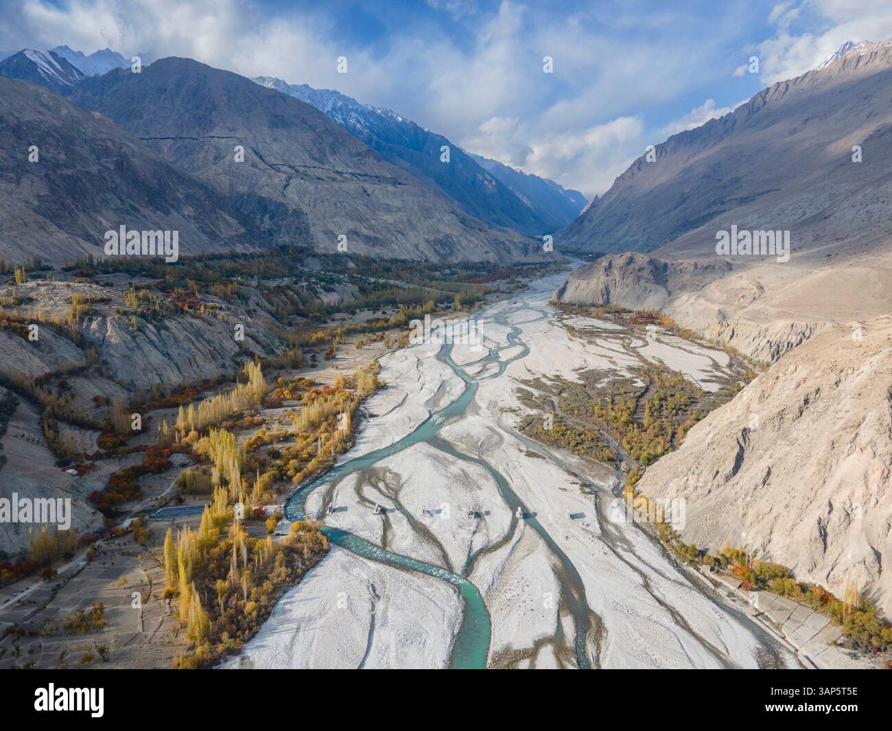 Aerial view of majestic mountains, tranquil river, and autumn trees in ...