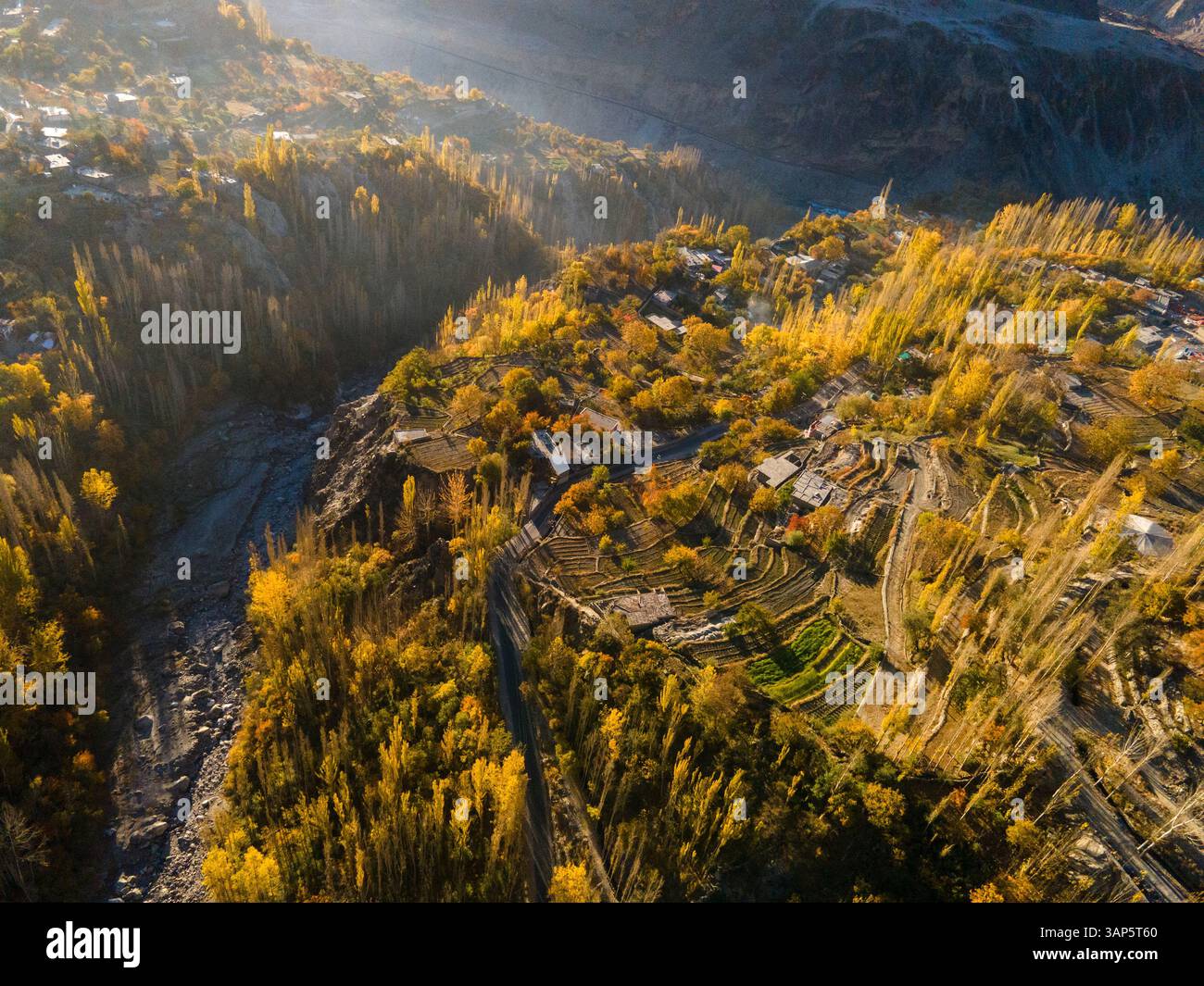 Aerial view of picturesque village nestled in majestic mountains and ...