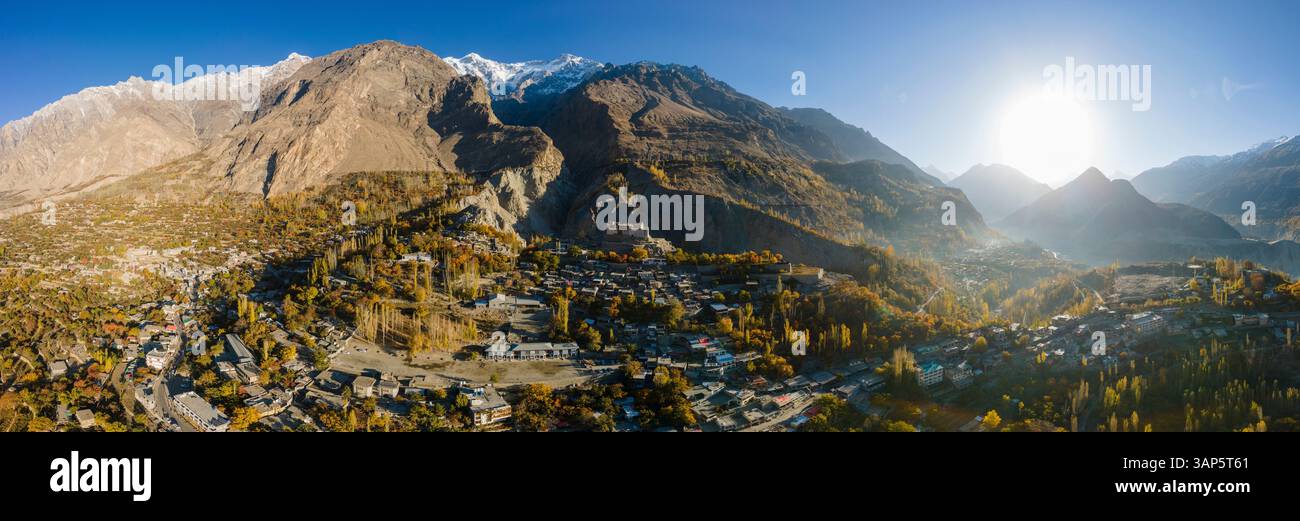 Aerial view of majestic sunrise over village and mountains, Hunza ...